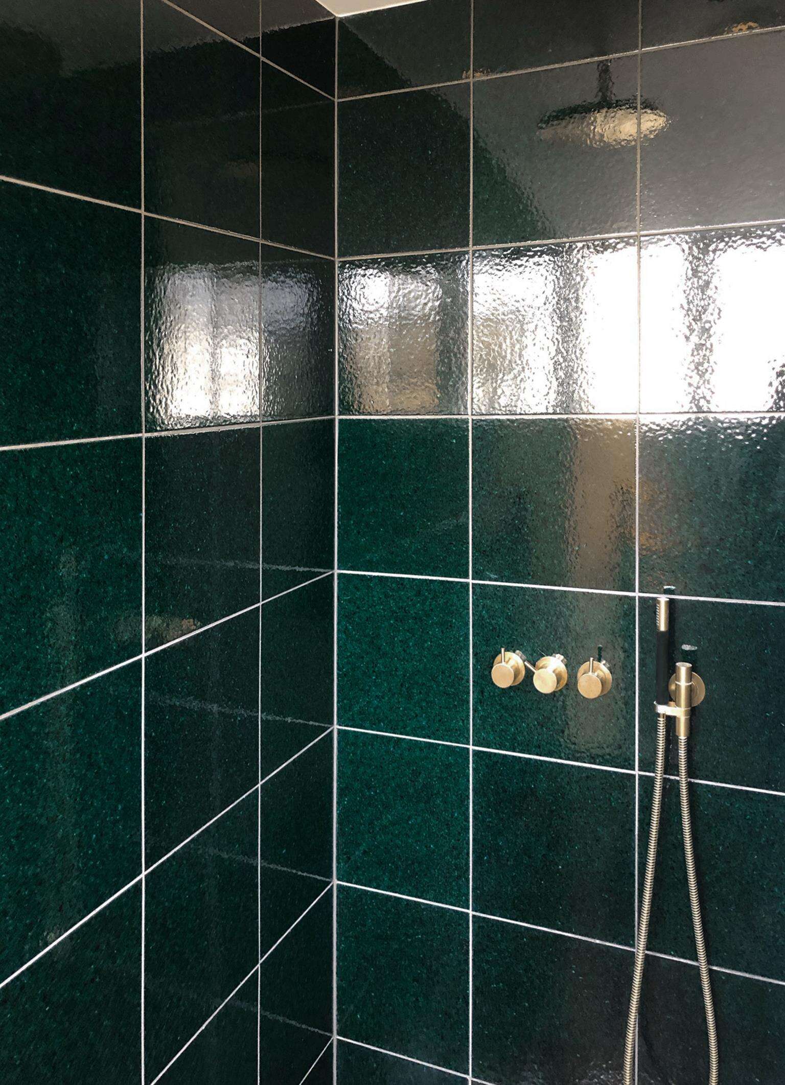 Dark emerald green lava stone bathroom - Danish design - By Made a Mano.