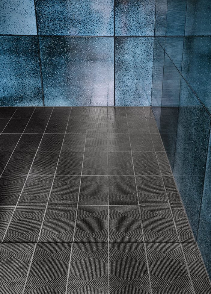 Speckled dark blue lava stone bathroom - By Made a Mano.